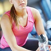 Taking a quick break between workouts | Buy Stock Photo on PeopleImages ...