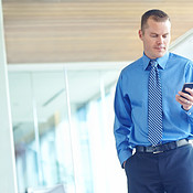 Checking his texts | Buy Stock Photo on PeopleImages, Picture And ...