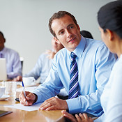Executives having a quick discussion | Buy Stock Photo on PeopleImages ...