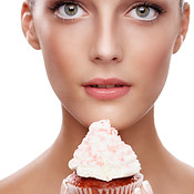 Her face is as sweet as her treat | Buy Stock Photo on PeopleImages ...