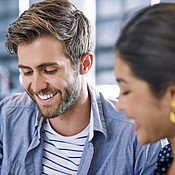 Working with a smile | Buy Stock Photo on PeopleImages, Picture And ...