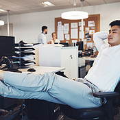 Relaxing after a day of hard work | Buy Stock Photo on PeopleImages ...
