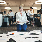 Sorting out her paperwork | Buy Stock Photo on PeopleImages, Picture ...