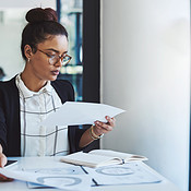 Processing paperwork like a pro | Buy Stock Photo on PeopleImages ...