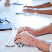 Typing up a new report | Buy Stock Photo on PeopleImages, Picture And ...