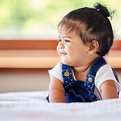 Baby girl bed house smiling house | Buy Stock Photo on PeopleImages ...