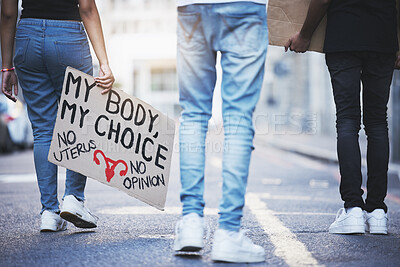 End racism sign cardboard poster in urban street background for ...