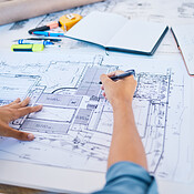 Architect sketching, planning or drawing an architectural design plan ...