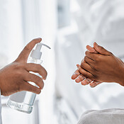 Doctor giving patient hand sanitizer for covid protection, hygiene and ...