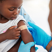 Doctor, healthcare expert and medical worker with plaster on arm of ...