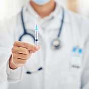 Healthcare, innovation and covid vaccine by doctor holding cure at ...