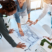 Building blueprint, architecture and engineering team planning a real ...