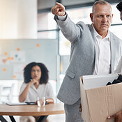 Black man, sad and fired by boss in a meeting holding a box in ...