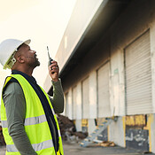 Construction worker, engineer black man manager on site inspection for ...