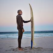 Surfing, surfboard and senior man on beach for water sports adventure ...