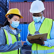 Covid, documents and supply chain logistics with a team working in ...