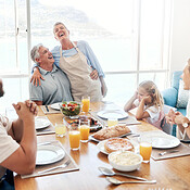 Breakfast, communication and big family eating food together at the ...