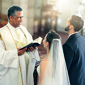 Wedding, couple and priest with a bible in church praying to God with a ...