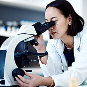 Microscope, Asian woman and in laboratory for research, innovation and ...