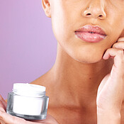 Skincare, beauty and woman with face cream product for dermatology ...