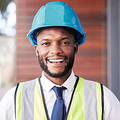 Portrait, engineer and black man with helmet, smile and construction ...