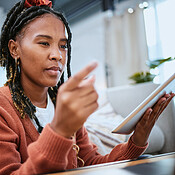 Black woman, tablet and reading on laptop for online email ...