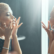 Woman, mirror and nightclub bathroom for makeup, beauty and cosmetics ...