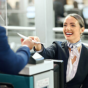 Airport, passport and travel with a woman passenger assistant helping a ...