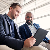 Business people, tablet and waiting at airport for schedule, travel or ...