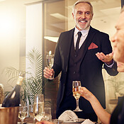 Man, toast and night at restaurant party with friends, business ...