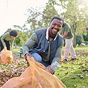Trash, volunteer portrait and man cleaning garbage pollution, waste ...