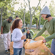 Trash volunteer, happy woman and child cleaning garbage, pollution or ...