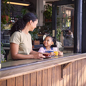 Coffee shop, black family and children with a mother and daughter ...
