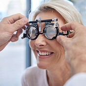 Hands, help or woman in eye exam or vision test for eyesight by doctor ...