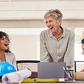 Laughing, conversation and employees in an engineering meeting for ...