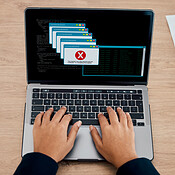 Error, office and hands typing on a laptop working on a web development ...