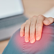 Hand, shoulder pain and closeup with a business man holding his joint ...