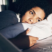 Anxiety, depression and sad woman tired in bed with insomnia, thinking ...