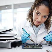 Computer hardware, soldering and portrait of black woman working on cpu ...