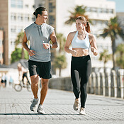 Couple, running and training together in the city for exercise, workout ...