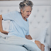 Back pain, elderly woman and health with injury and old age, medical ...