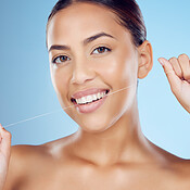 Floss, teeth and portrait of woman in studio for beauty, healthy body ...