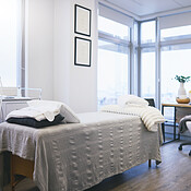 Bed, surgery and empty room for ophthalmology consultation, vision ...