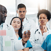 Brainstorming, teamwork and writing with doctors in meeting for ...