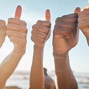People, hands and diversity with thumbs up at beach for good job ...