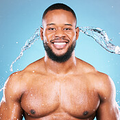 Muscle, strong and water splash for black man cleaning, hygiene and ...