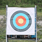 Bullseye target paper, outdoor and board at shooting range for weapon ...