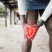 Fitness, netball and knee pain with leg of black woman for sports ...