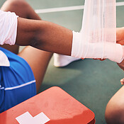 Sport injury, bandage and first aid with wrist pain and help, health ...