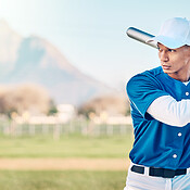 Sports, baseball and man with bat in action ready to hit ball in game ...